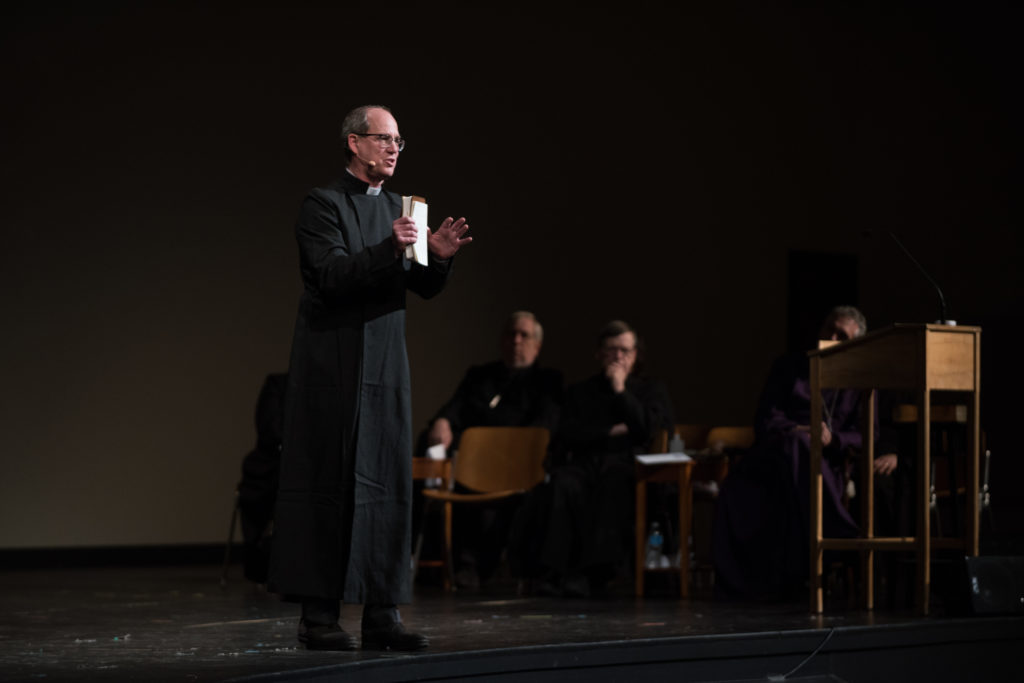 Why do some people wear robes in Anglican churches?